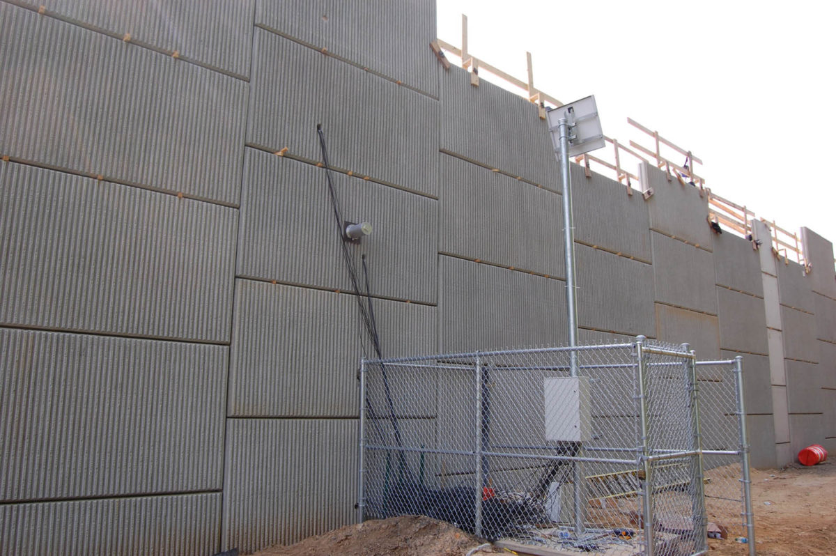Instrumented MSE wall reinforced with polyester straps - Geosynthetics ...