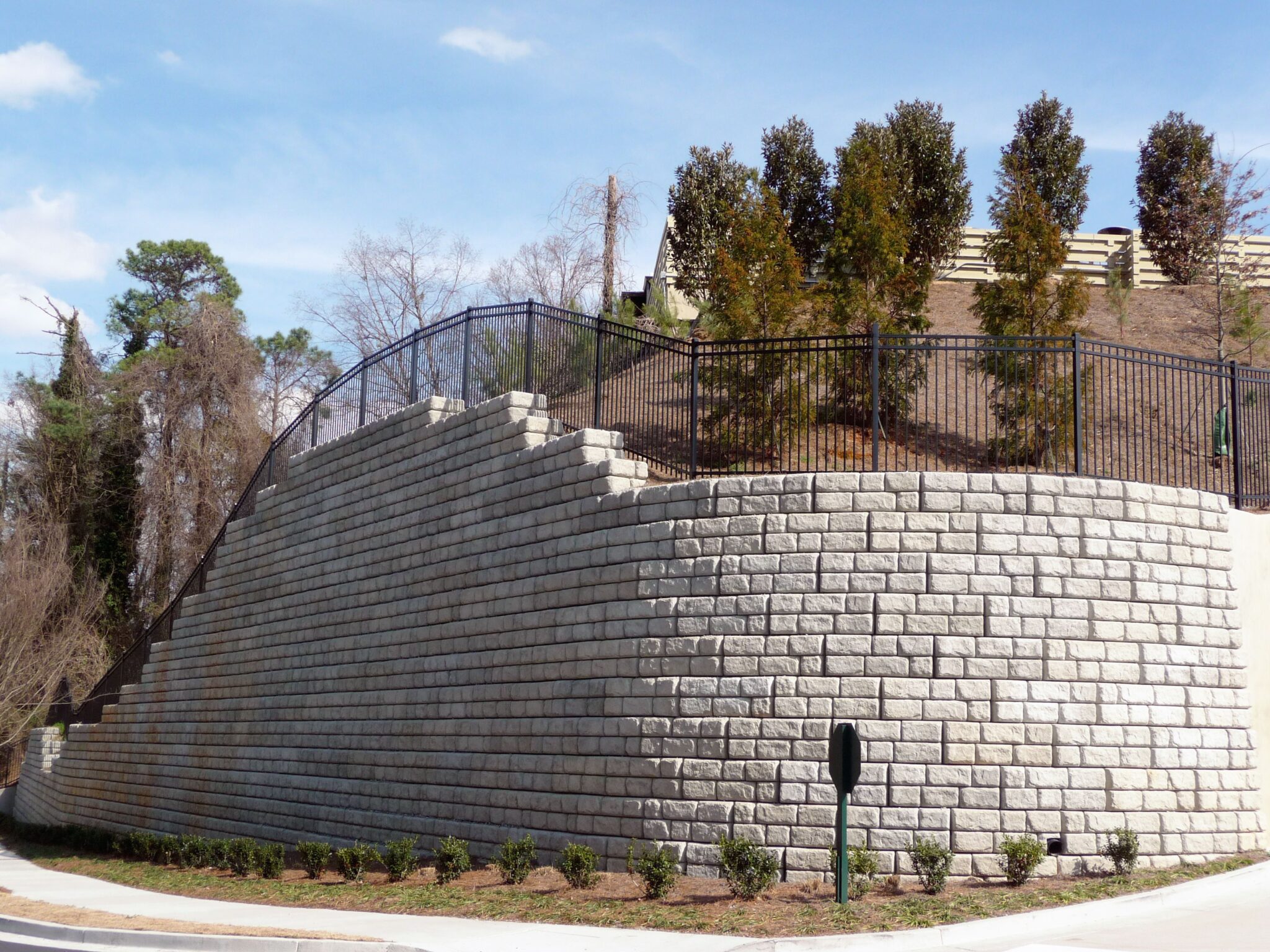 Redi-Rock reinforced retaining wall solution used for difficult ...