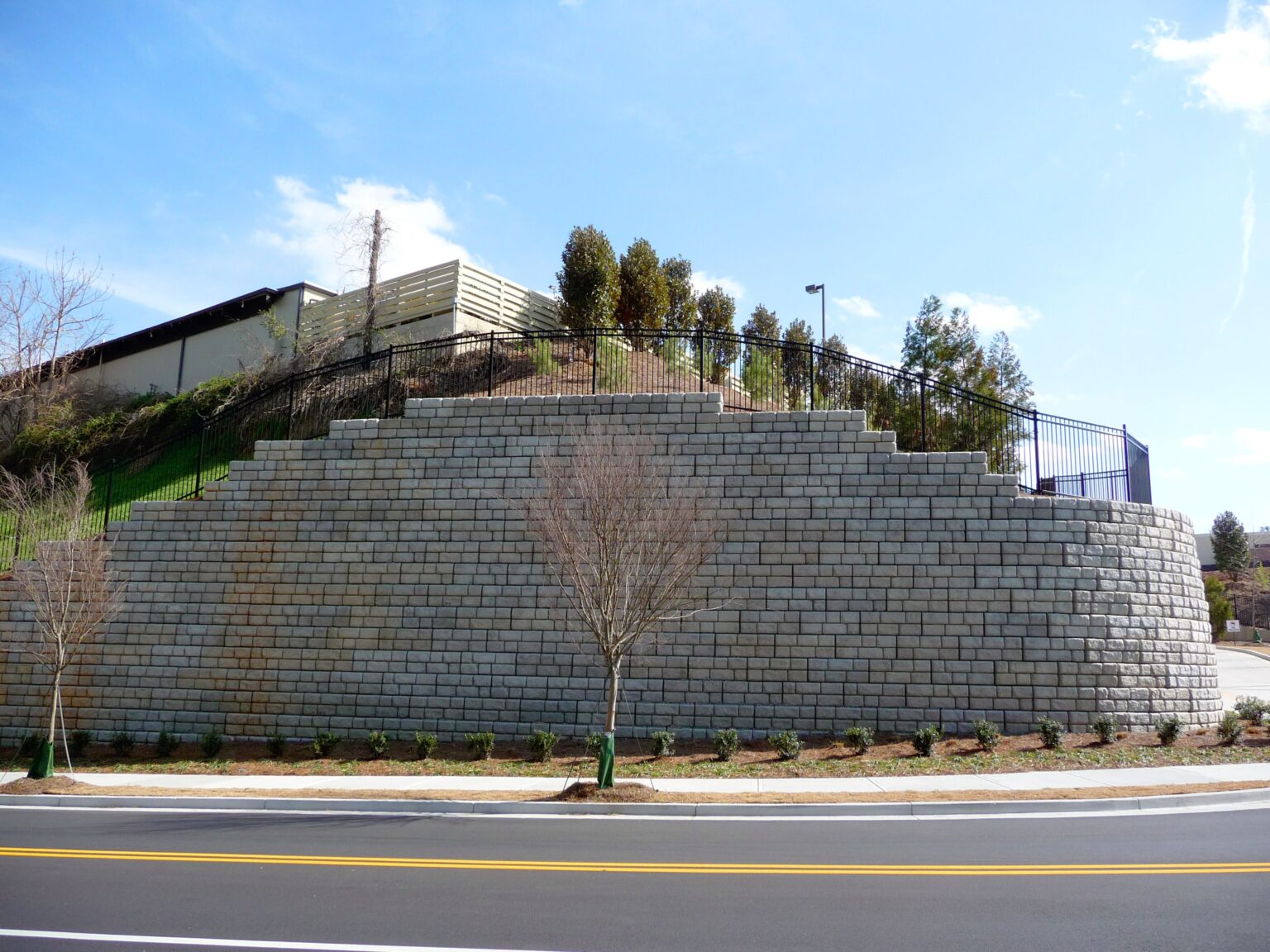 Redi-Rock reinforced retaining wall solution used for difficult ...